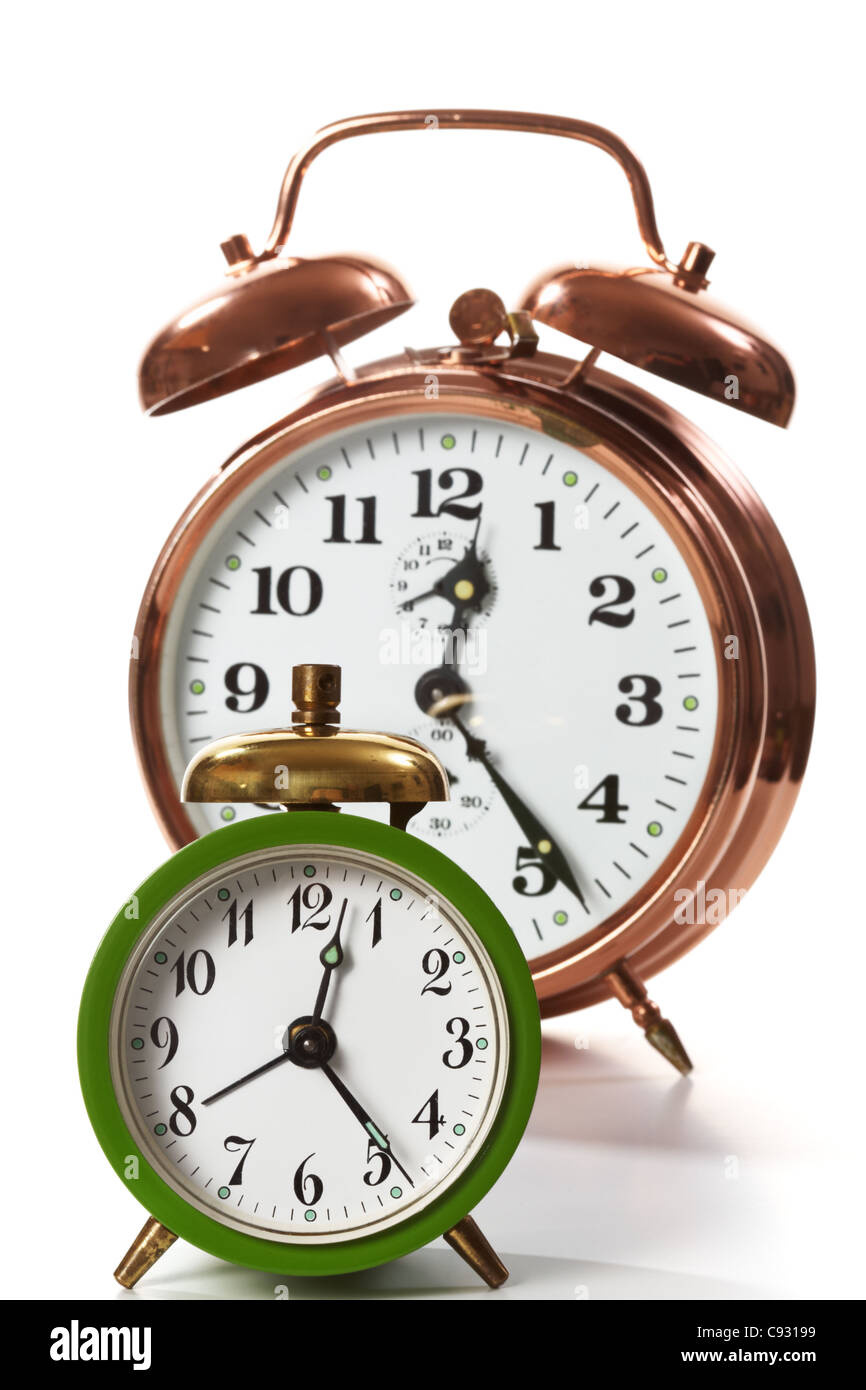 Two alarm clocks on white Stock Photo - Alamy