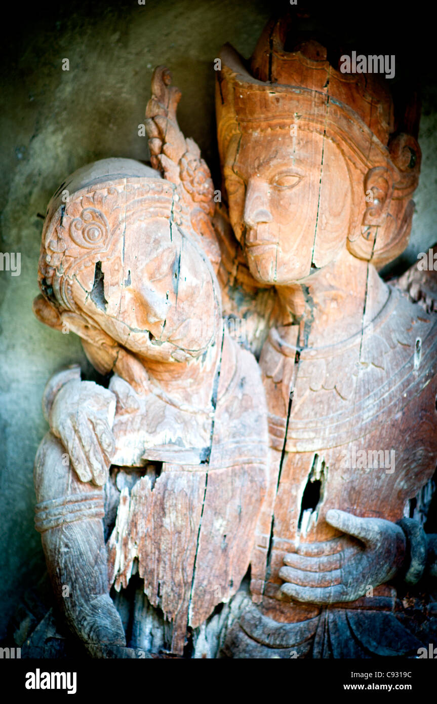 Old worn wooden statues Stock Photo - Alamy