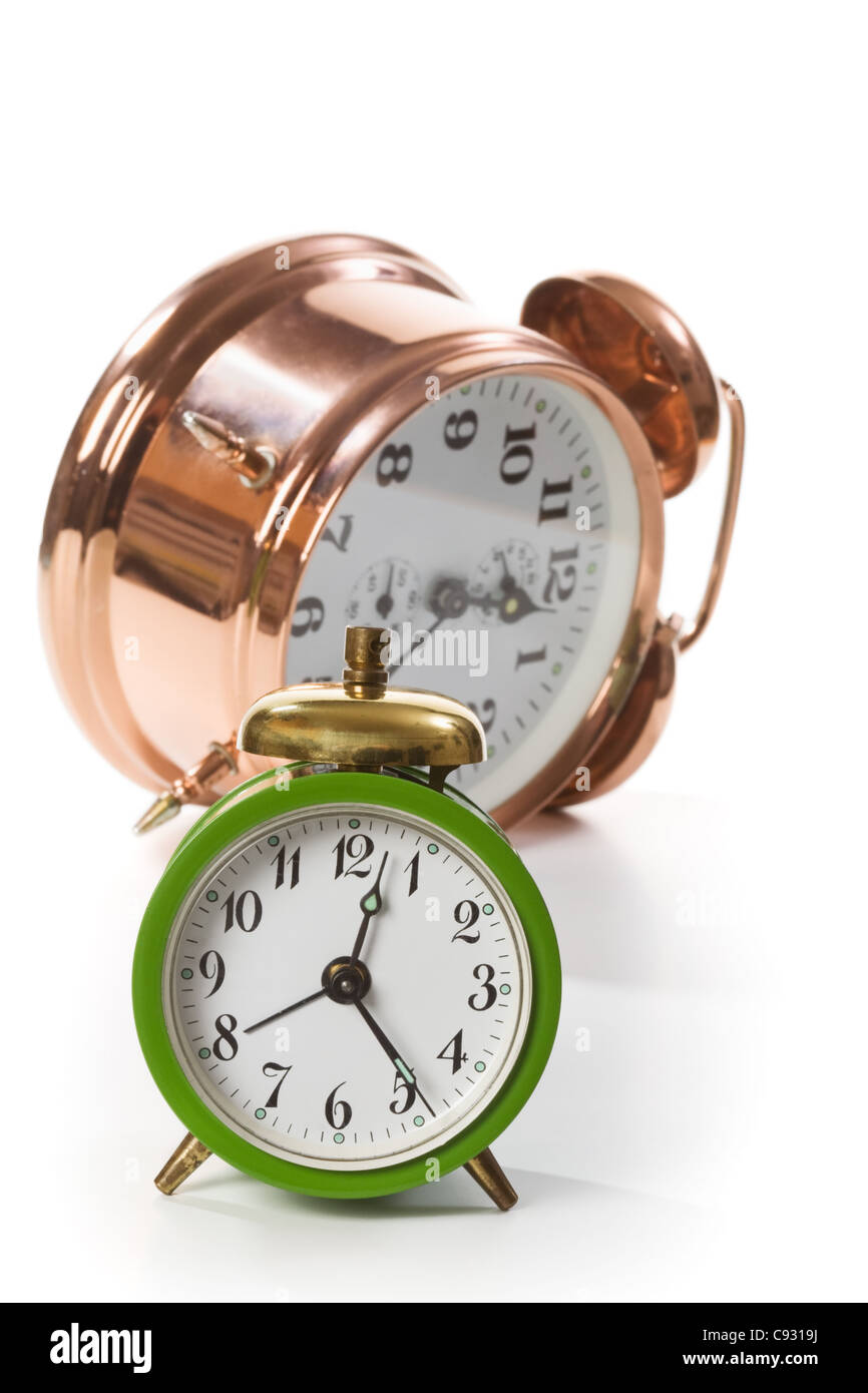 Two alarm clocks on white Stock Photo - Alamy