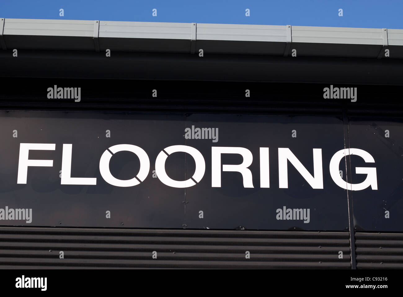 Detail of wall with flooring shop sign Stock Photo - Alamy