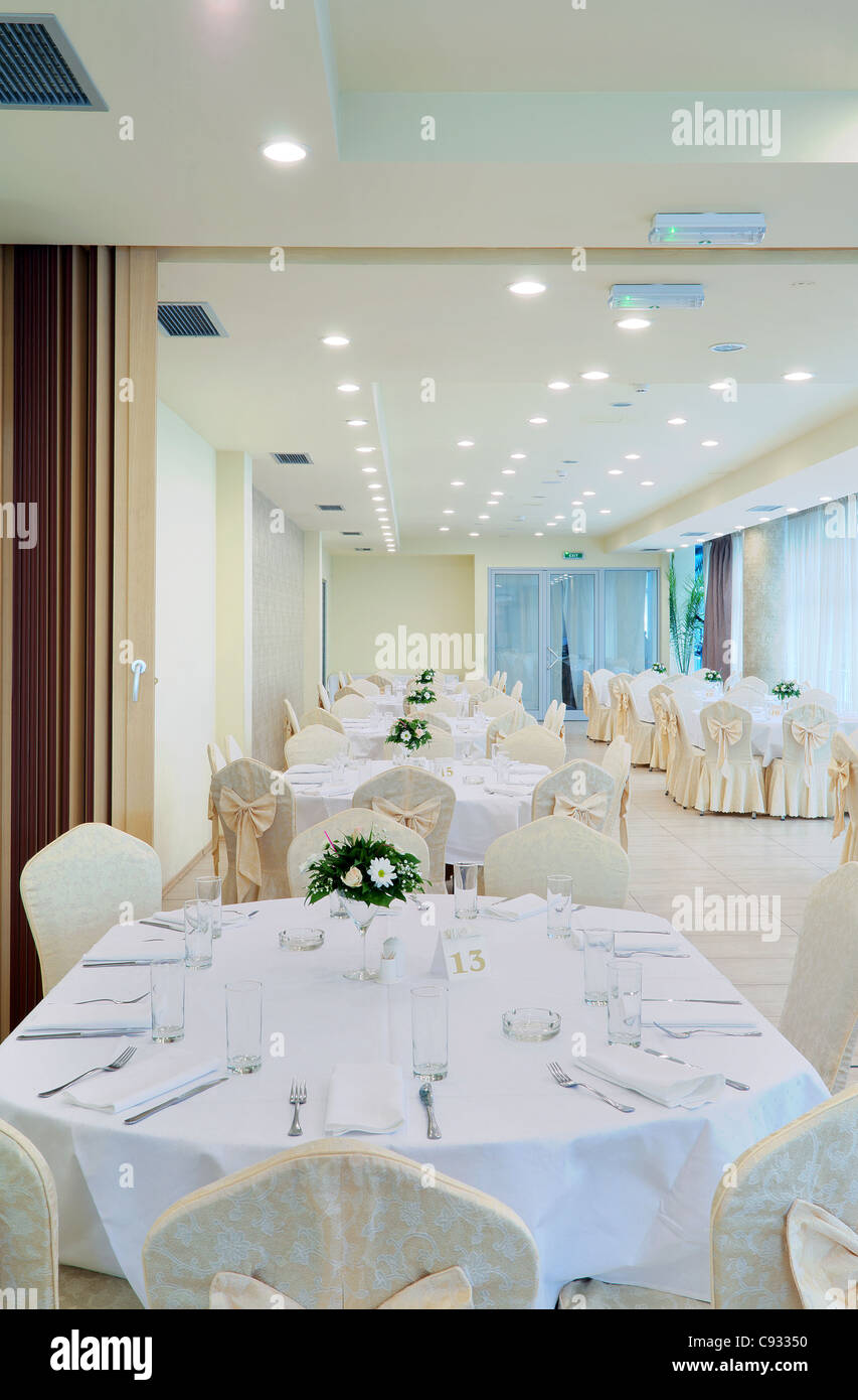 Interior of a restaurant prepared for wedding ceremony Stock Photo - Alamy