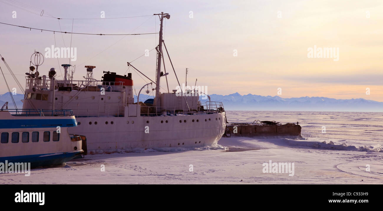 Frozen port. Winter. Group of ships. Lake Baikal Stock Photo - Alamy