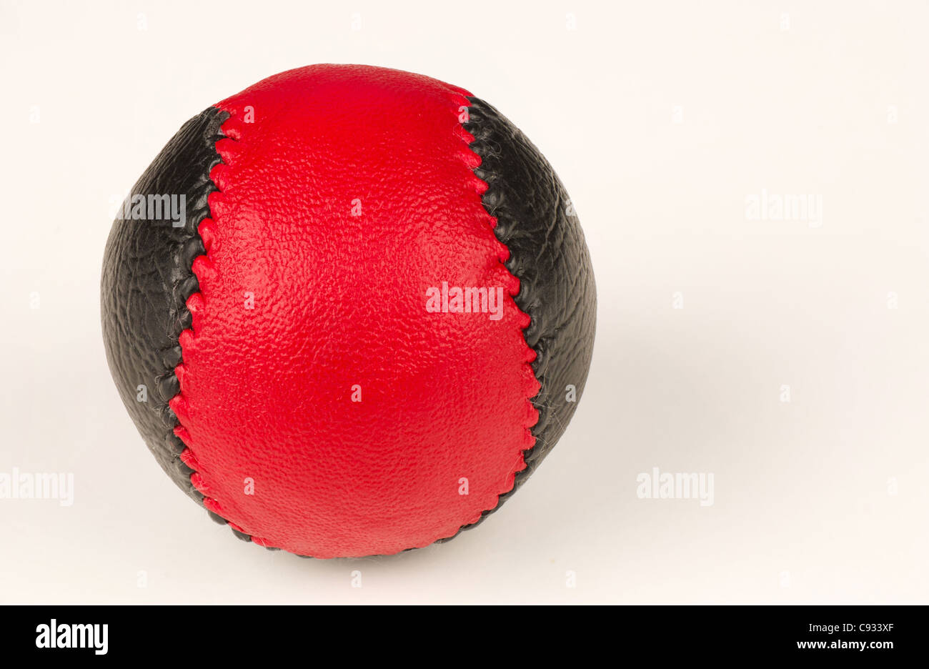 Traditional handmade Spanish pelota ball, with its typical coarse seams ...