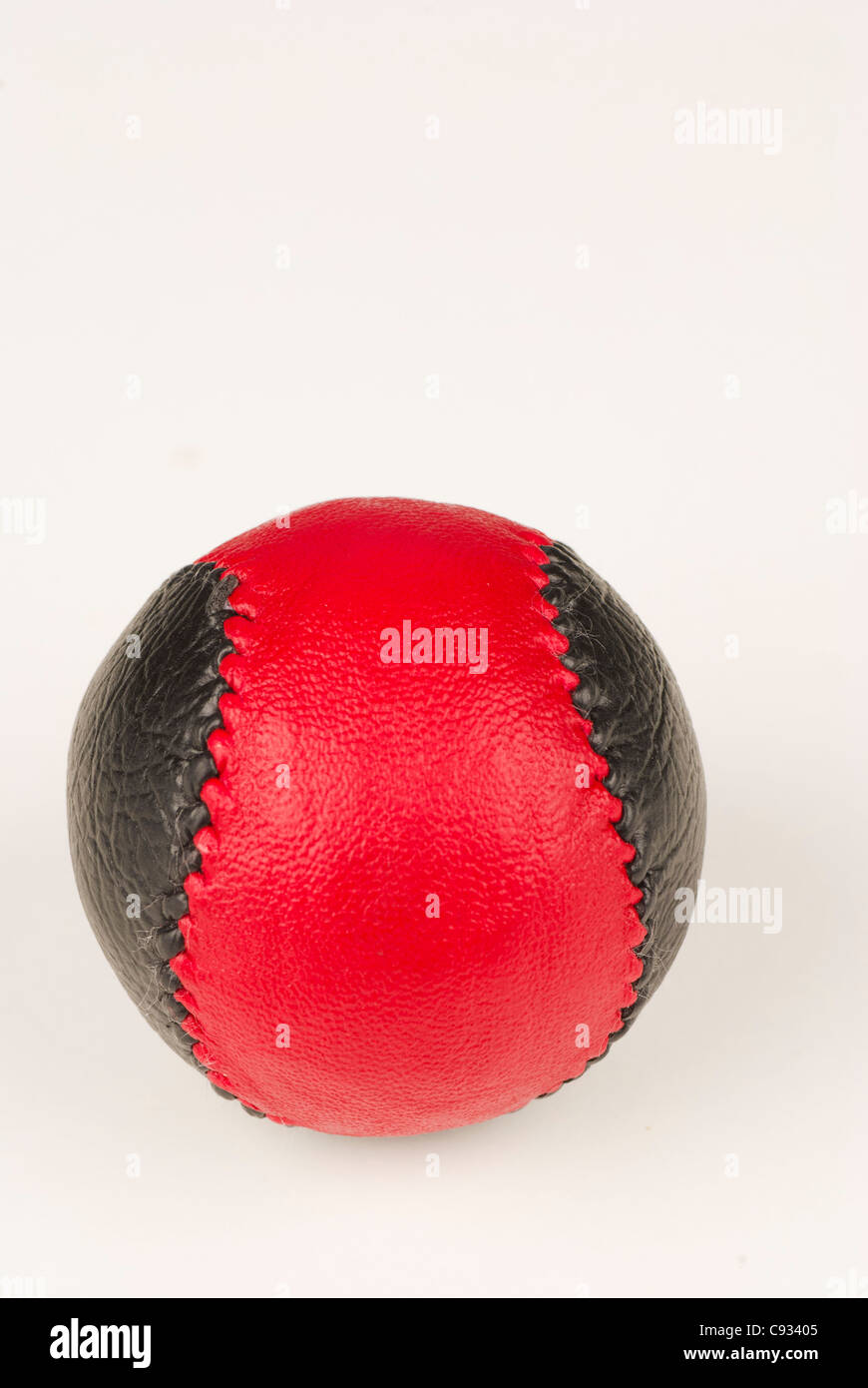 Traditional handmade Spanish pelota ball, with its typical coarse seams ...
