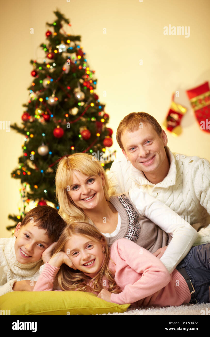 Portrait of four happy family members looking at camera at home Stock ...