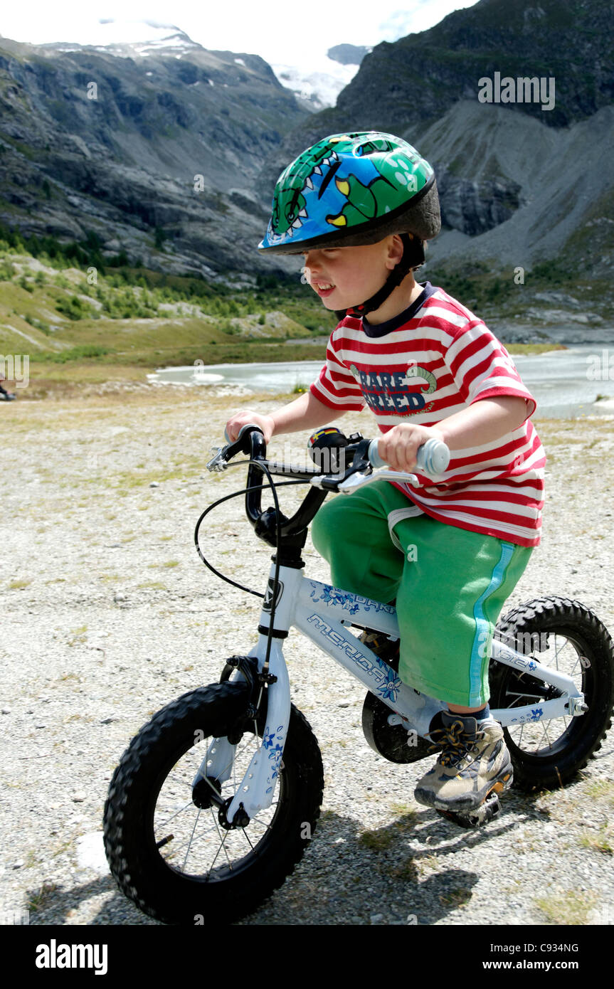 A boy learning to ride a bike Stock Photo - Alamy