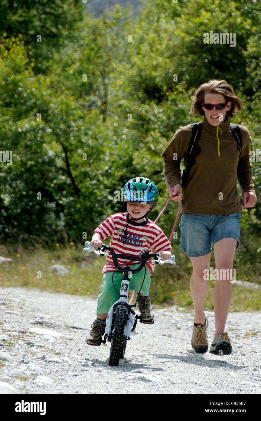 A boy learning to ride a bike Stock Photo - Alamy