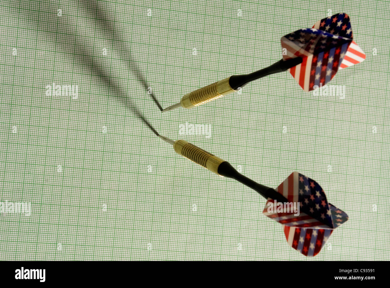 Darts on a graph paper Stock Photo - Alamy