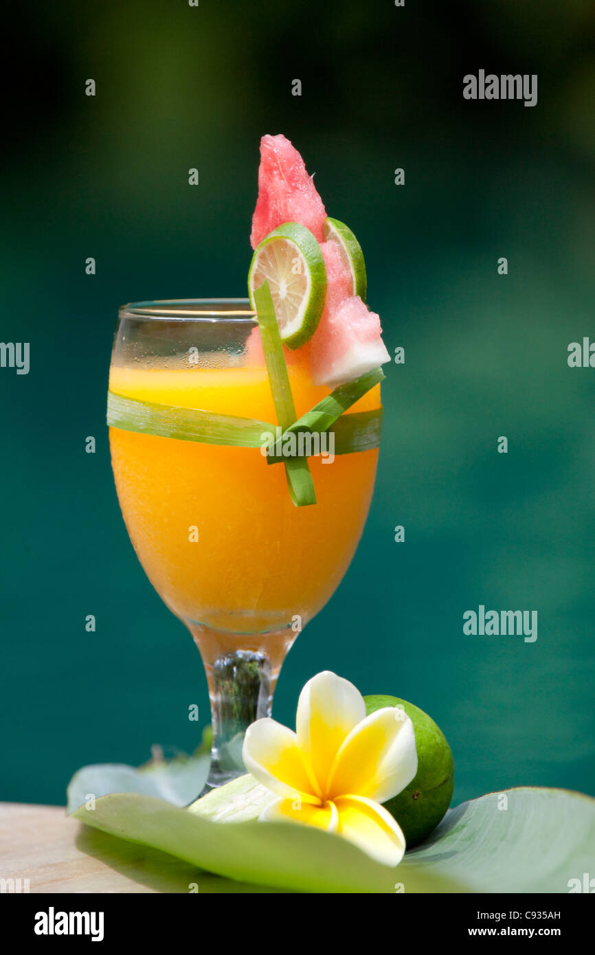 Bali, Ubud. A freshly squeezed fruit juice with tropical garnish by a ...