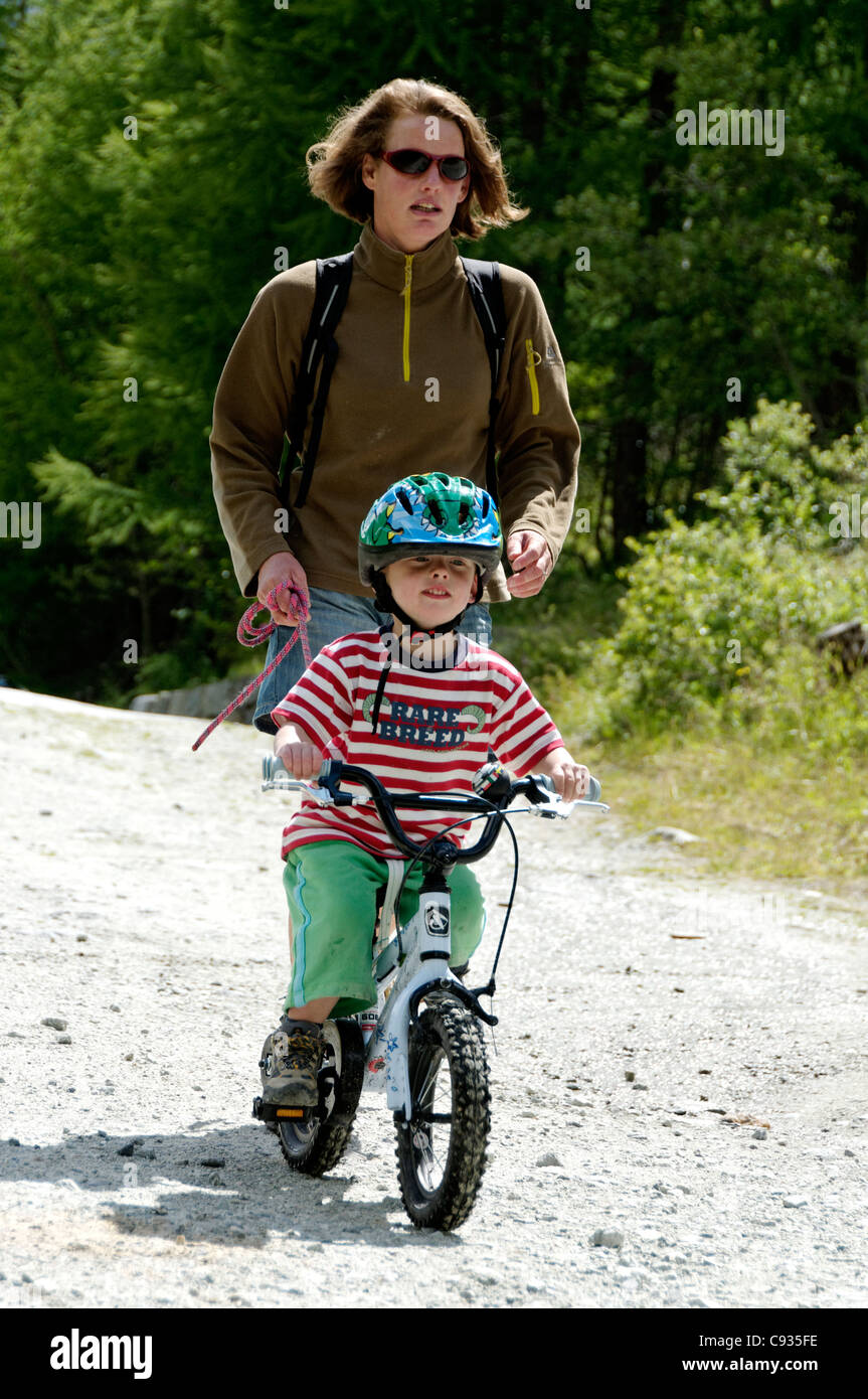 A boy learning to ride a bike Stock Photo - Alamy