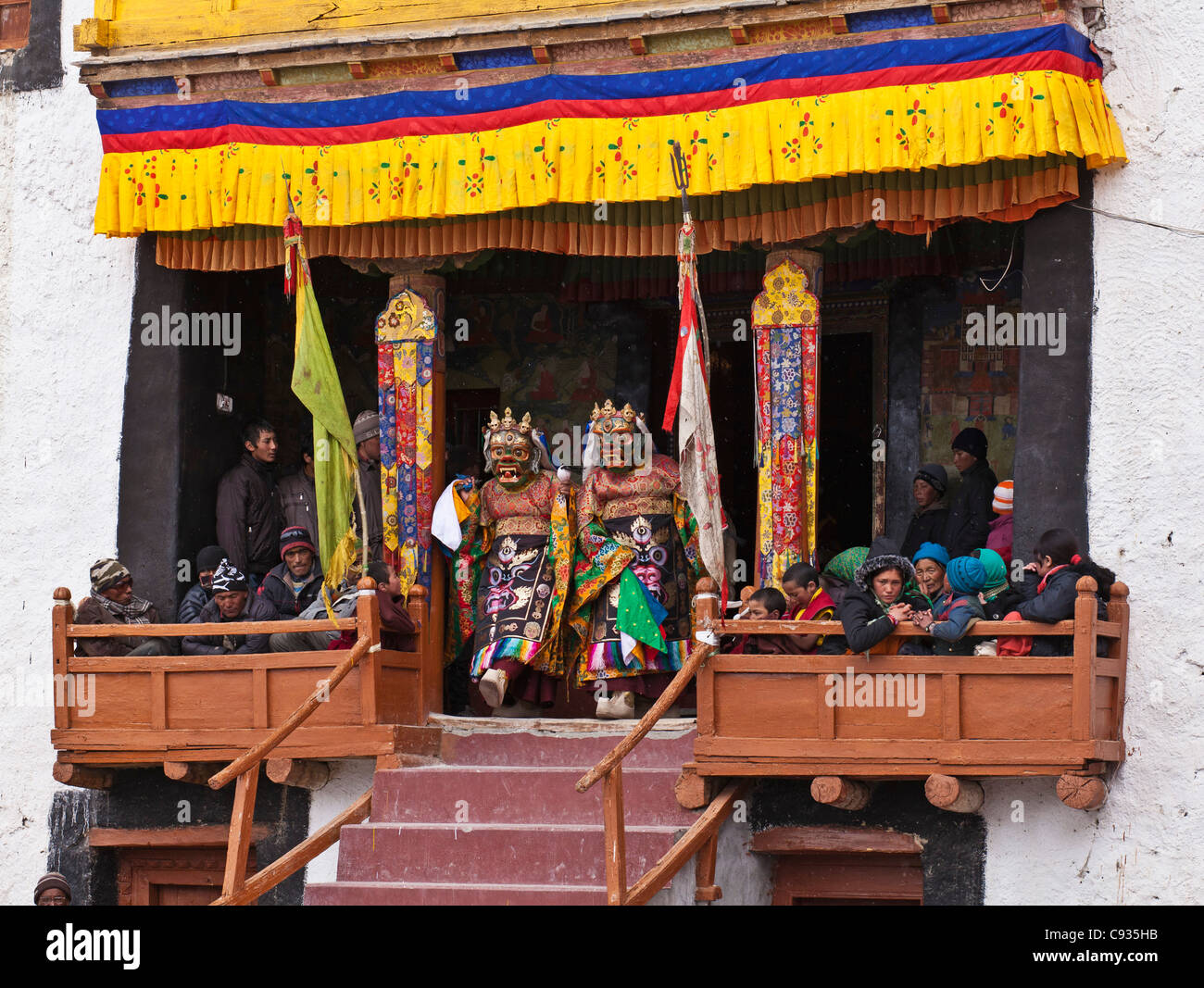 India, Ladakh, Likir. Monks in masked costumes and silk brocade finery ...