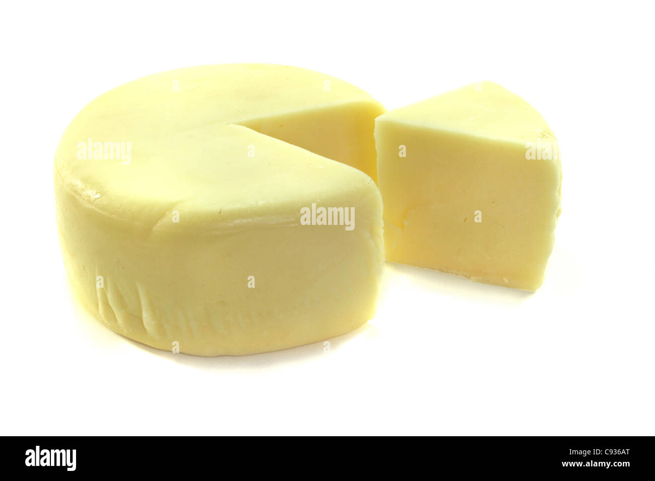 Cheese wheel with a piece of cheese on a white background Stock Photo ...