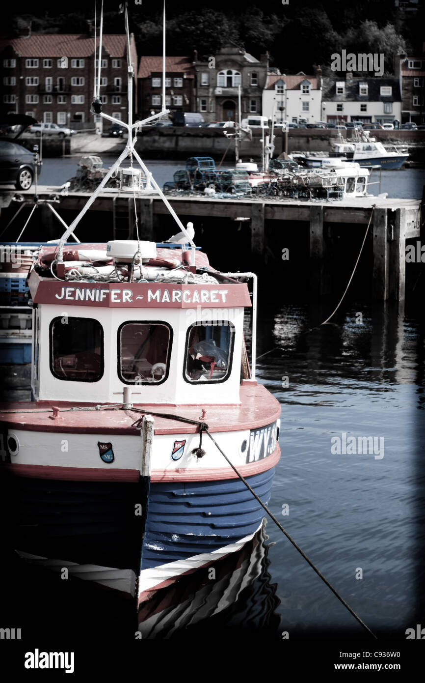 Whitby by the sea, with the boats at the docks and dockyard showing the ...