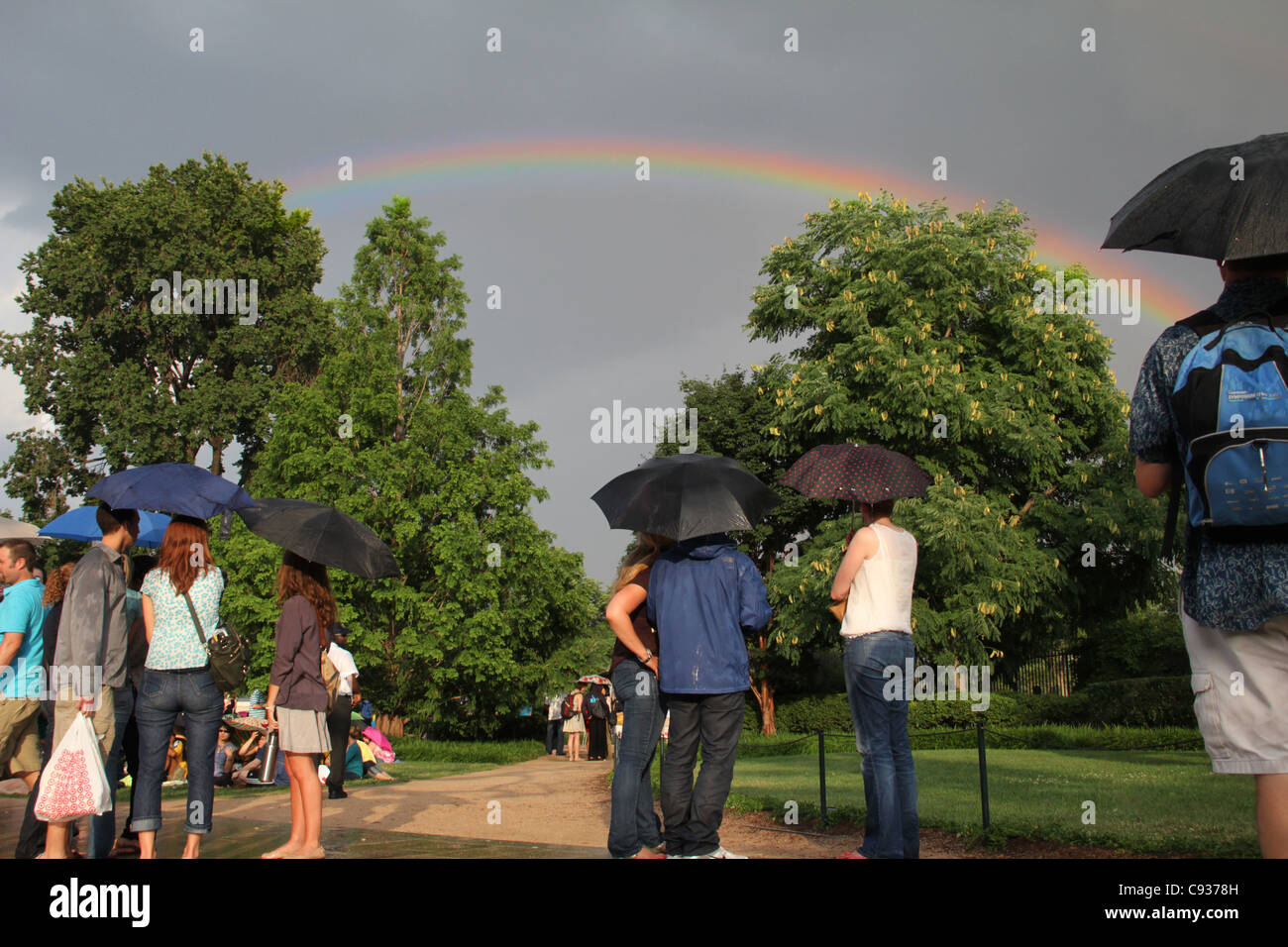 Rainbow in the park with many people Stock Photo - Alamy