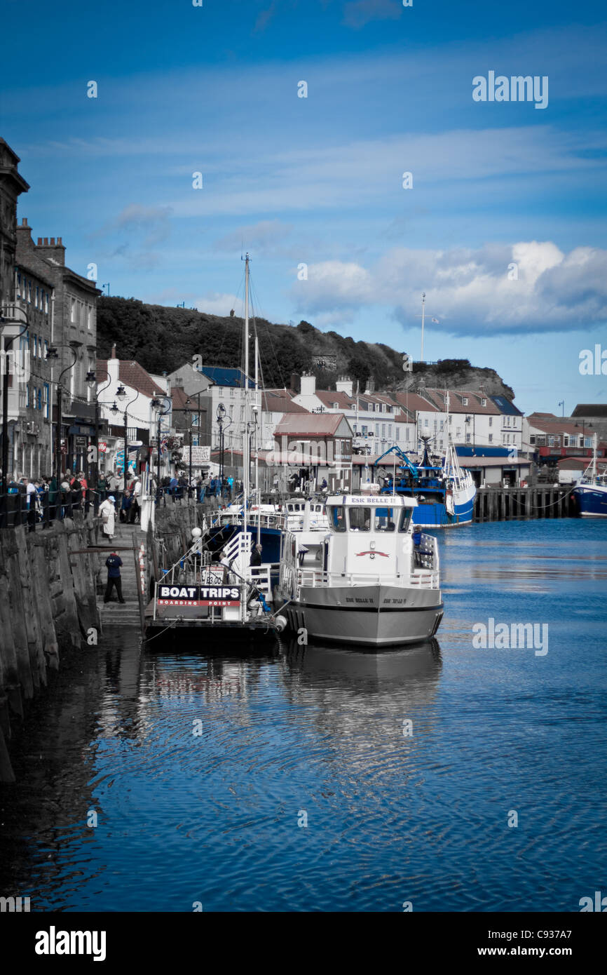 Whitby by the sea, with the boats at the docks and dockyard showing the ...