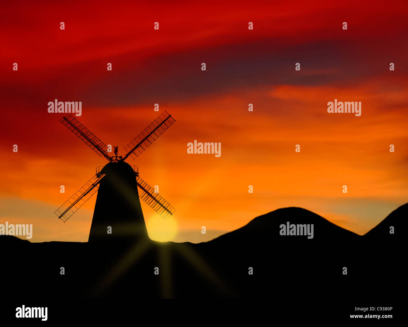 windmill in silhouette with dramatic sky Stock Photo - Alamy