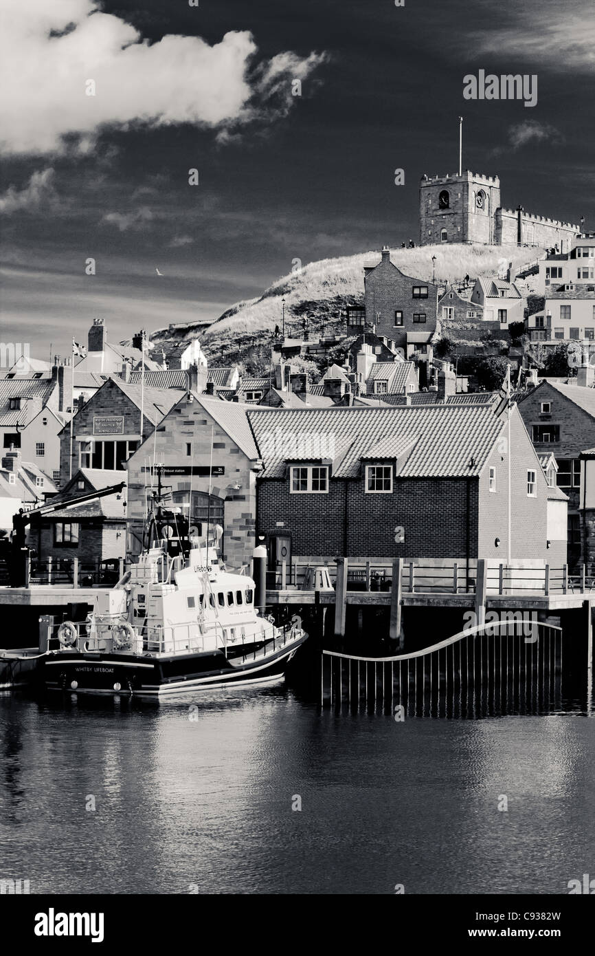 Whitby by the sea, with the boats at the docks and dockyard showing the ...