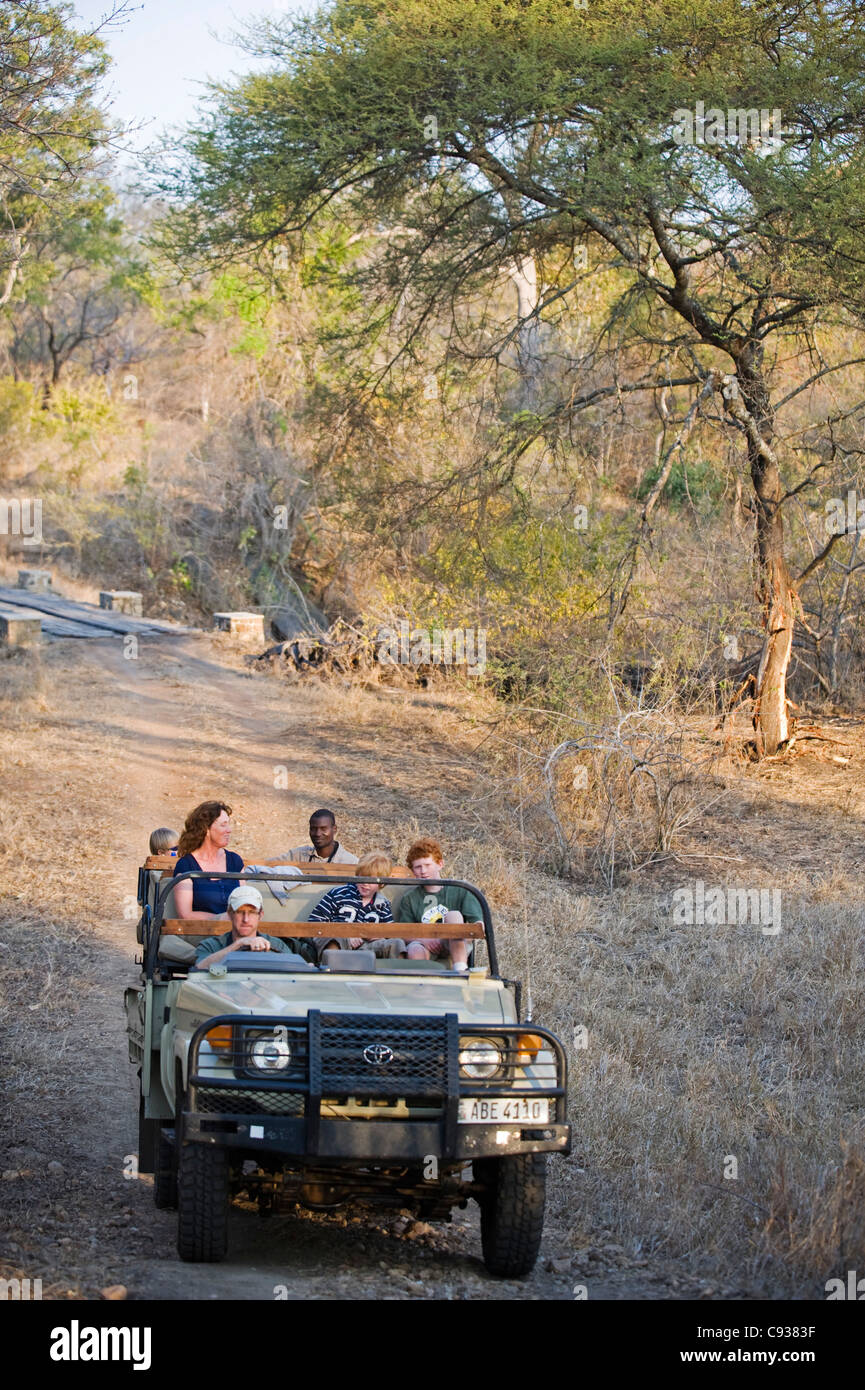 Malawi, Majete Wildlife Reserve. Family in their safari vehicle whilst ...