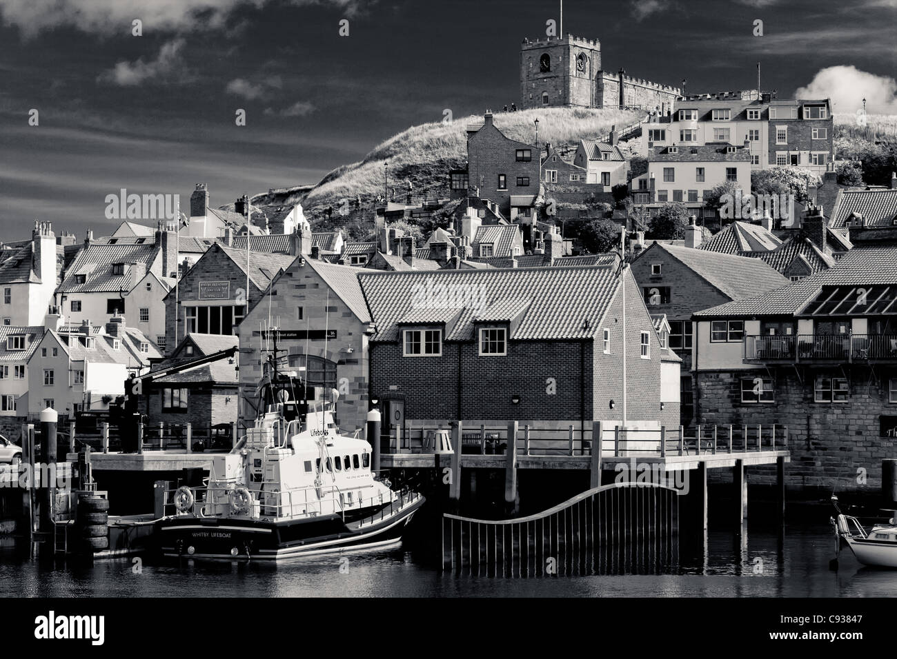 Whitby by the sea, with the boats at the docks and dockyard showing the ...