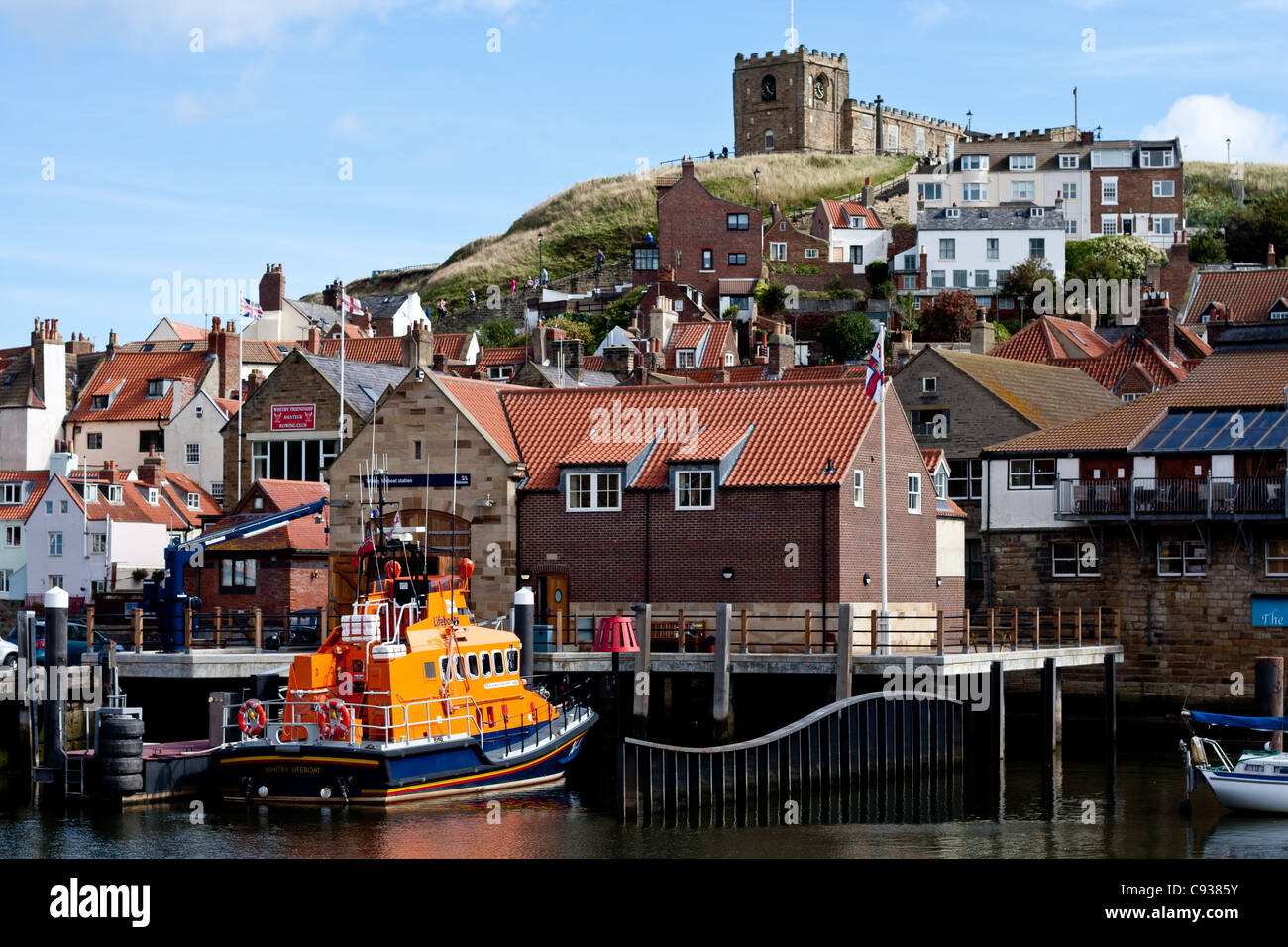 Whitby by the sea, with the boats at the docks and dockyard showing the ...