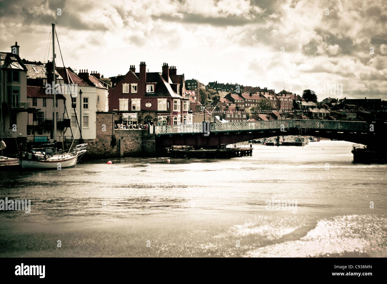 Whitby by the sea, with the boats at the docks and dockyard showing the ...