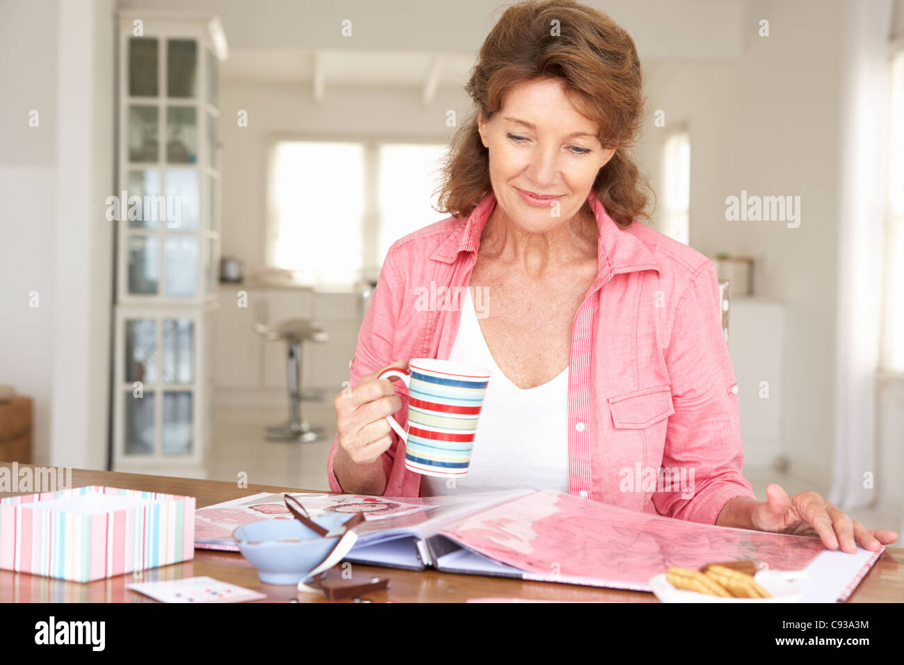 Senior woman scrapbooking Stock Photo - Alamy
