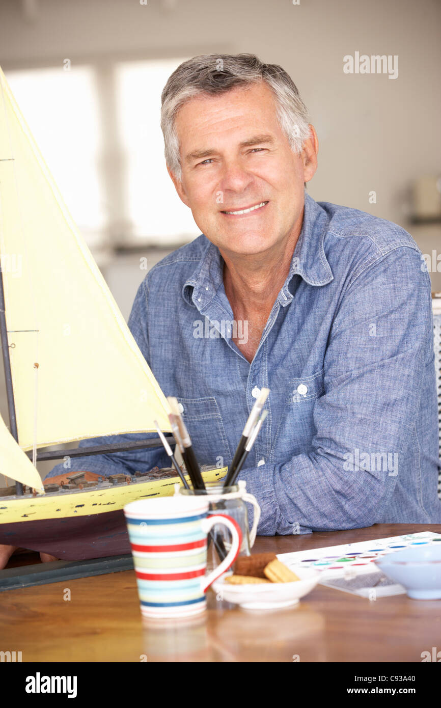 Senior man model making Stock Photo - Alamy