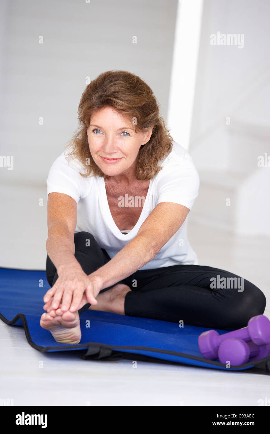 Senior woman exercising at home Stock Photo - Alamy