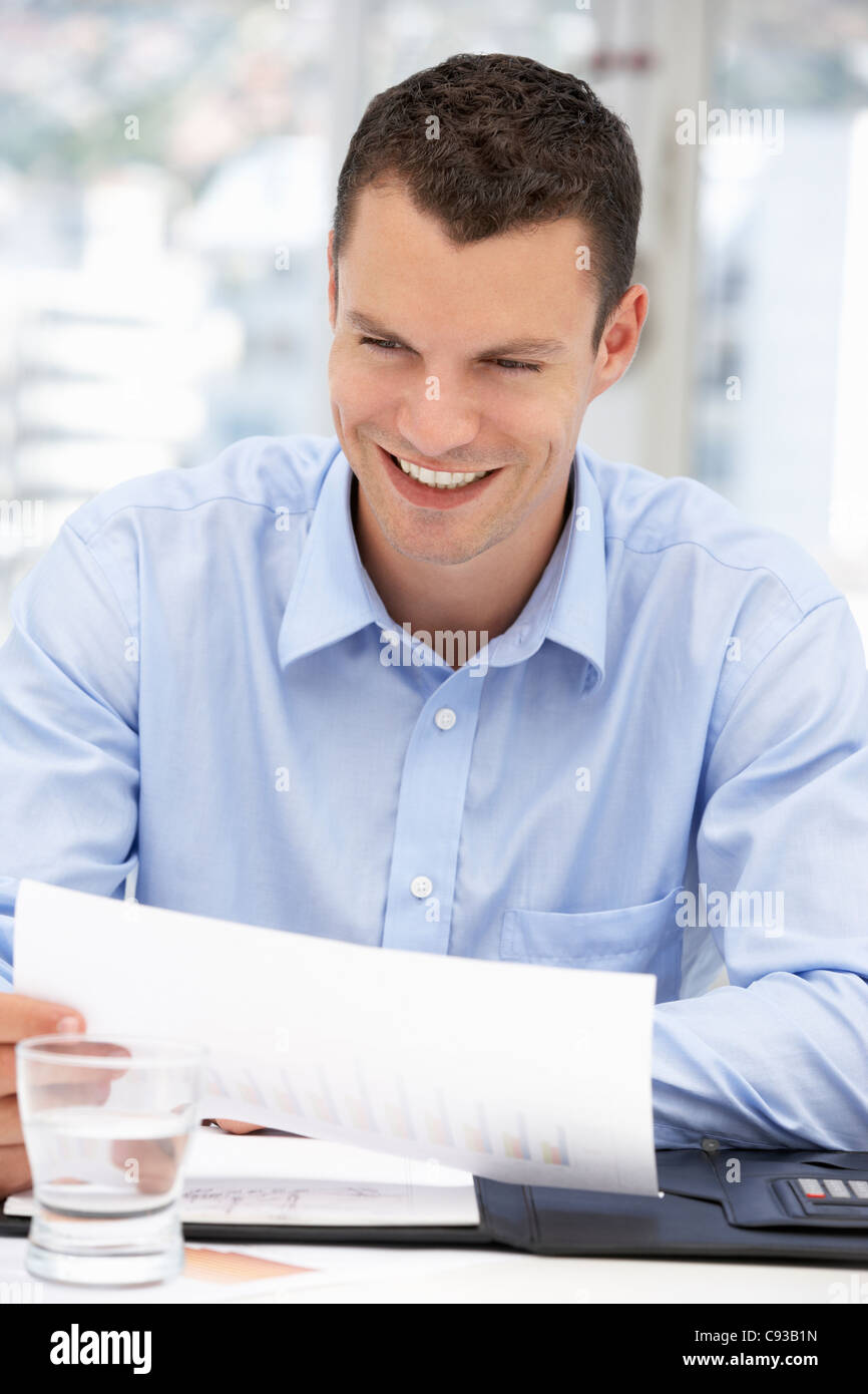 Happy young businessman Stock Photo - Alamy