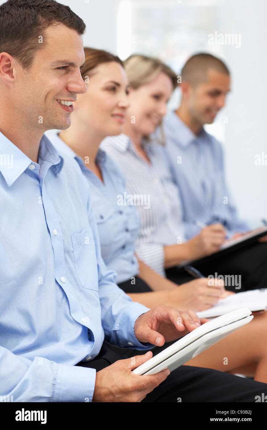 Group watching business presentation Stock Photo - Alamy