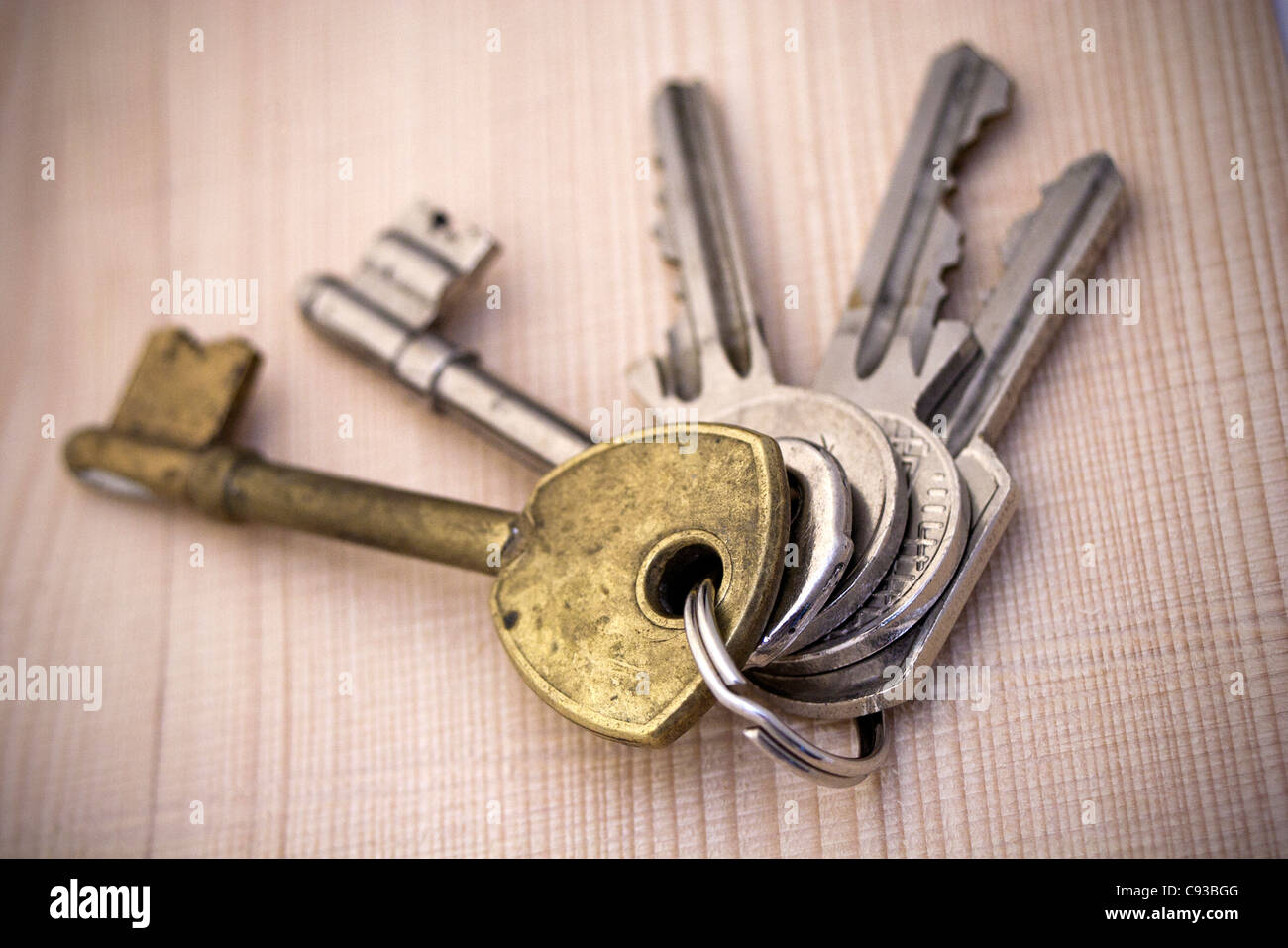 a set of metal keys on a table Stock Photo - Alamy