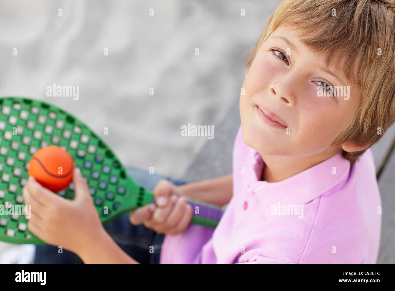 Young boy outdoors with bat and ball Stock Photo - Alamy