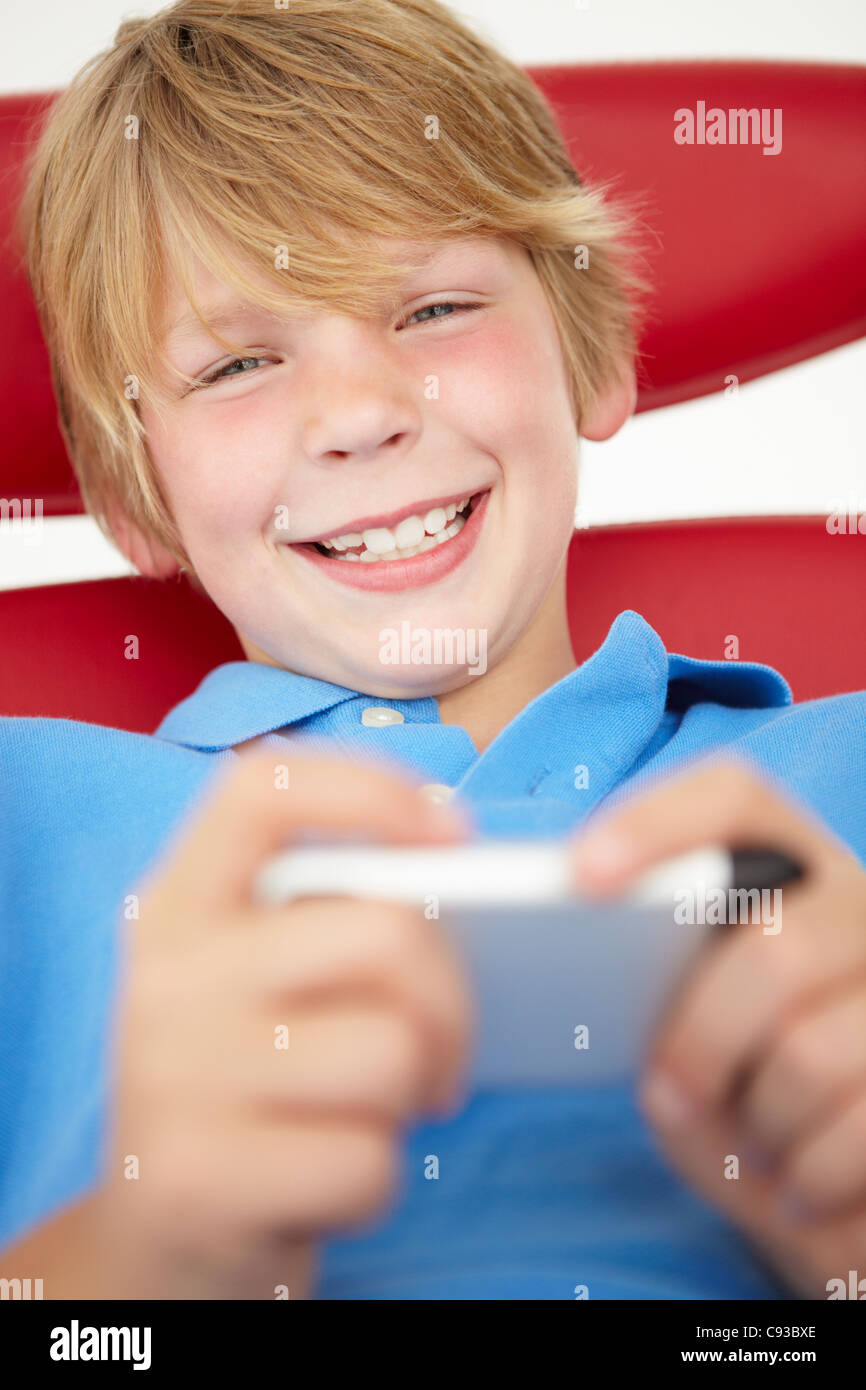 Young boy using cellphone Stock Photo - Alamy