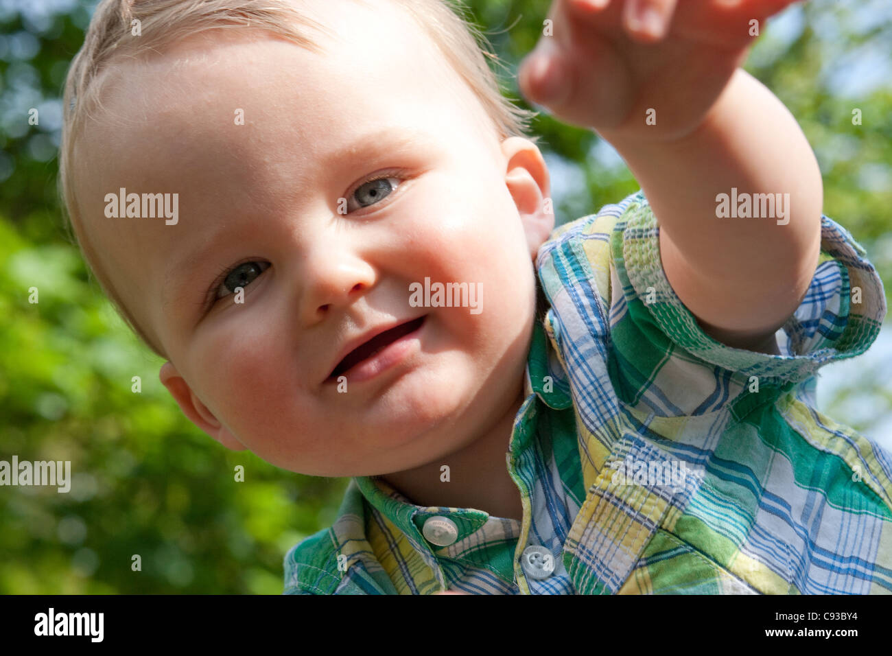 Child grabbing at camera hi-res stock photography and images - Alamy