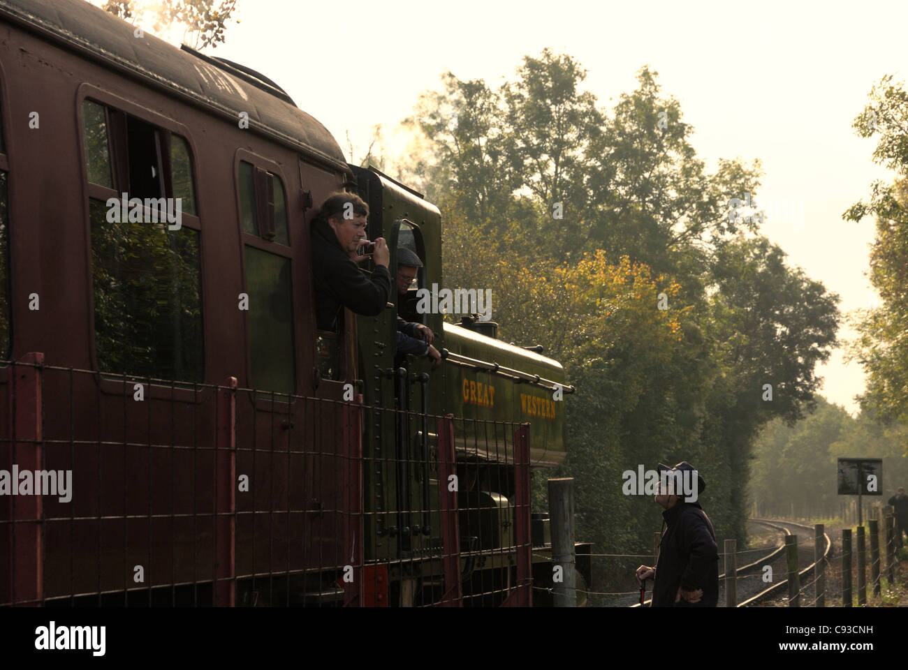 Steam train locomotive driver talks to a passing walker on the Avon ...