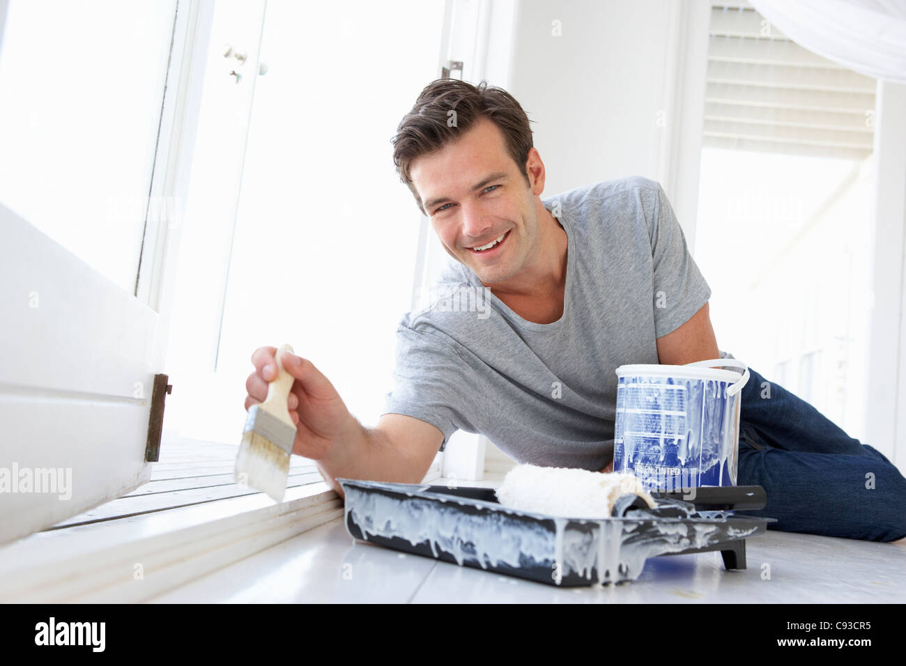 Man decorating house Stock Photo - Alamy