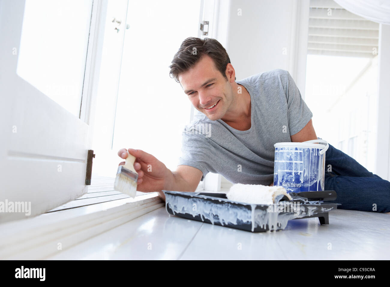 Man decorating house Stock Photo - Alamy