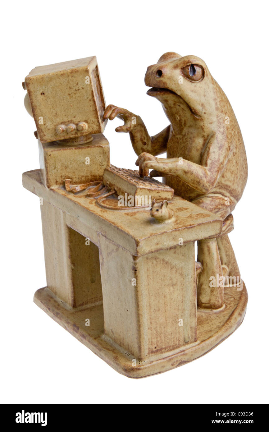 Pottery ornament depicting a frog using a computer Stock Photo - Alamy