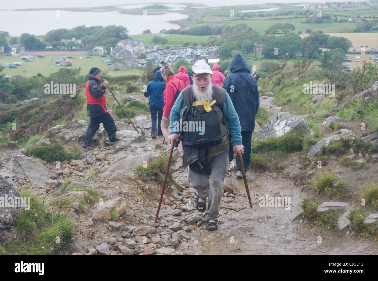 A pilgrim begins the ascent of Croagh Patrick on 'Reek Sunday' 2011 ...