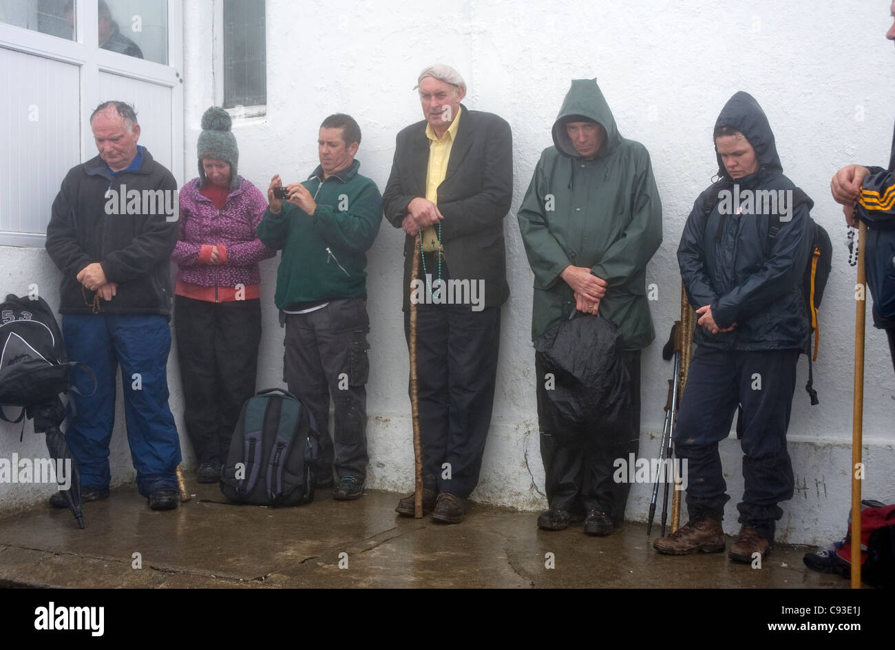 Pigrims celebrate Mass at the summit of Croagh Patrick during 'Reek ...