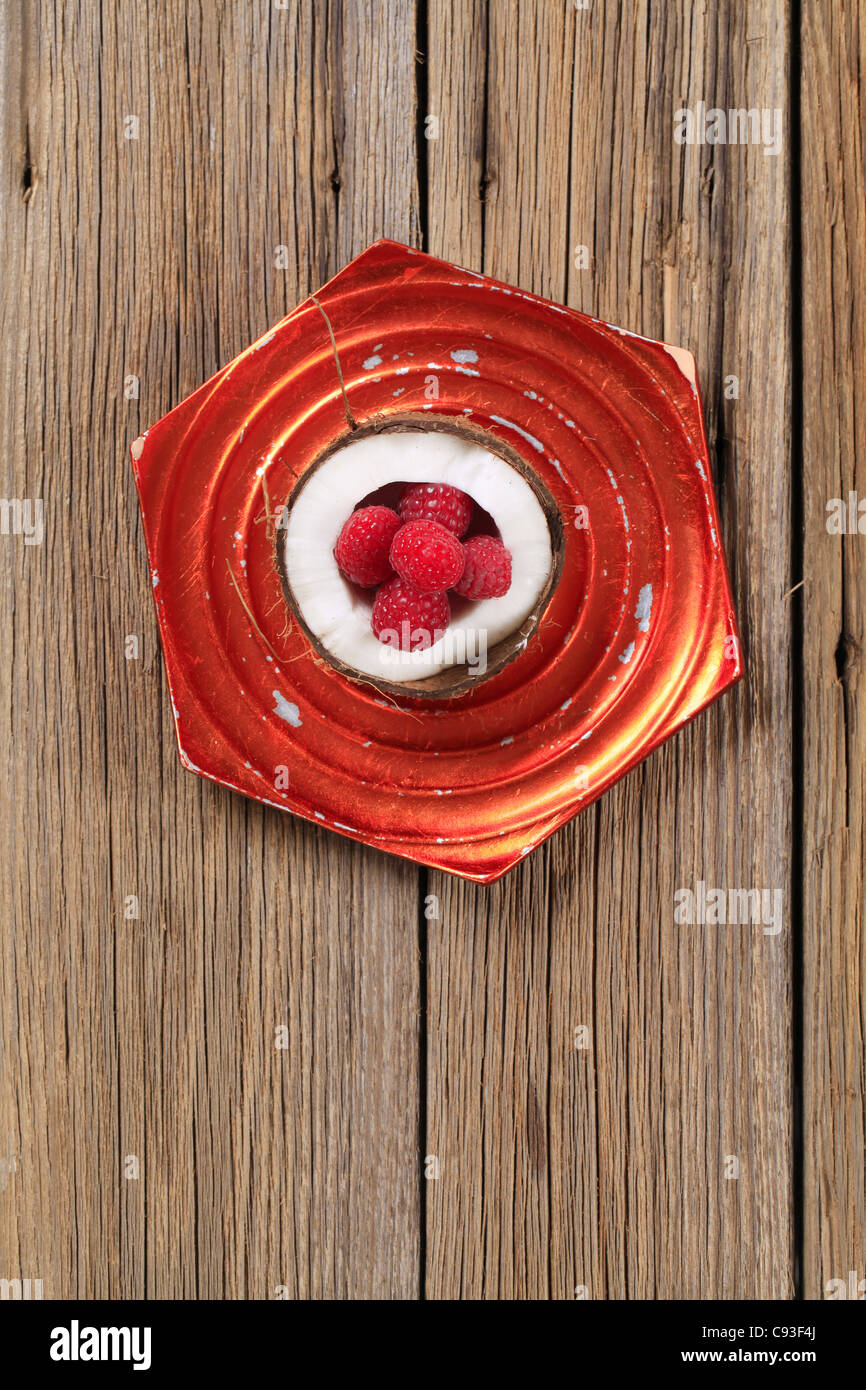 Fresh red raspberries in a coconut shell Stock Photo - Alamy