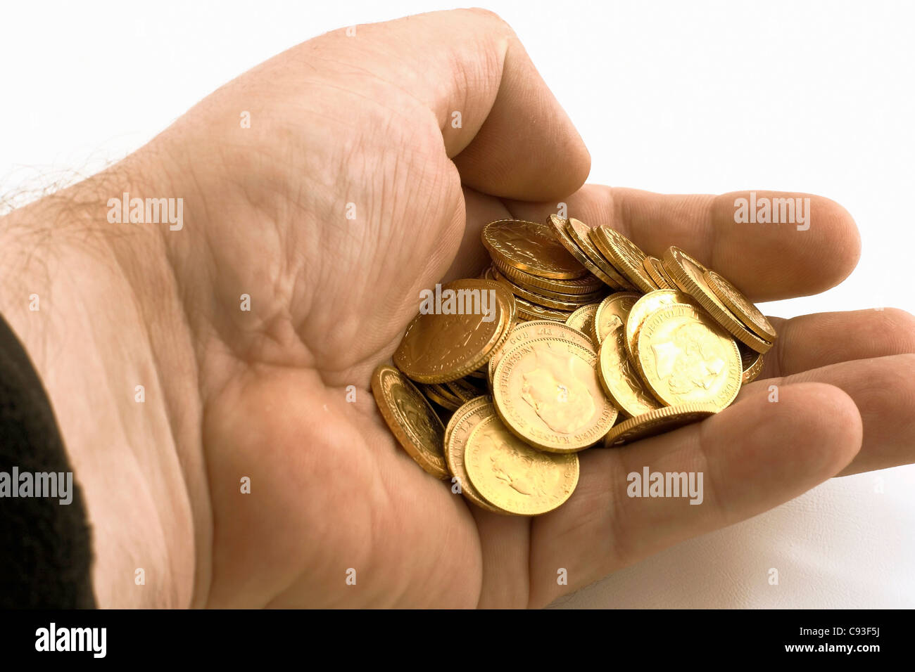 hand with gold coins Stock Photo - Alamy