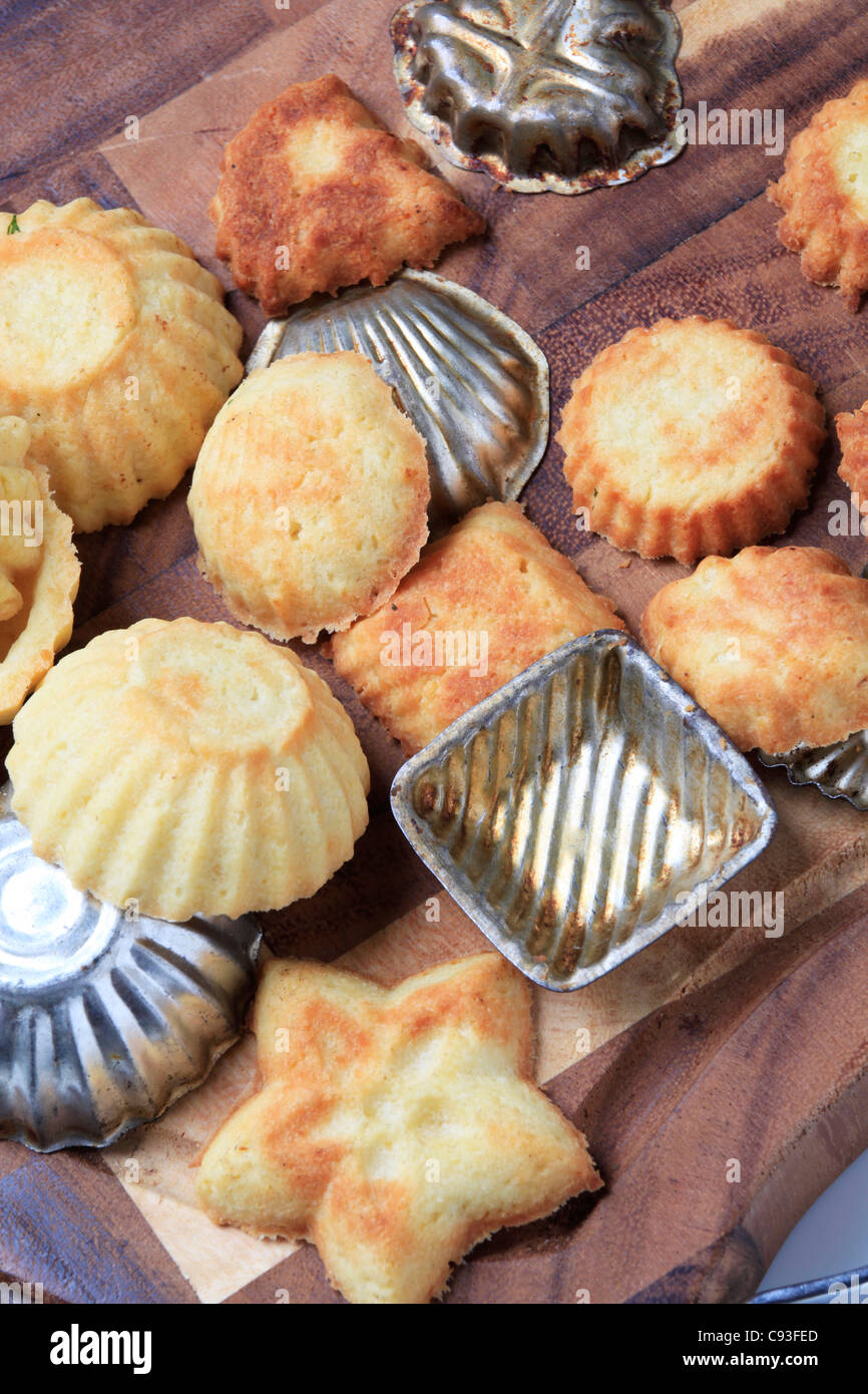 Small tart shells and baking pans on a cutting board Stock Photo - Alamy
