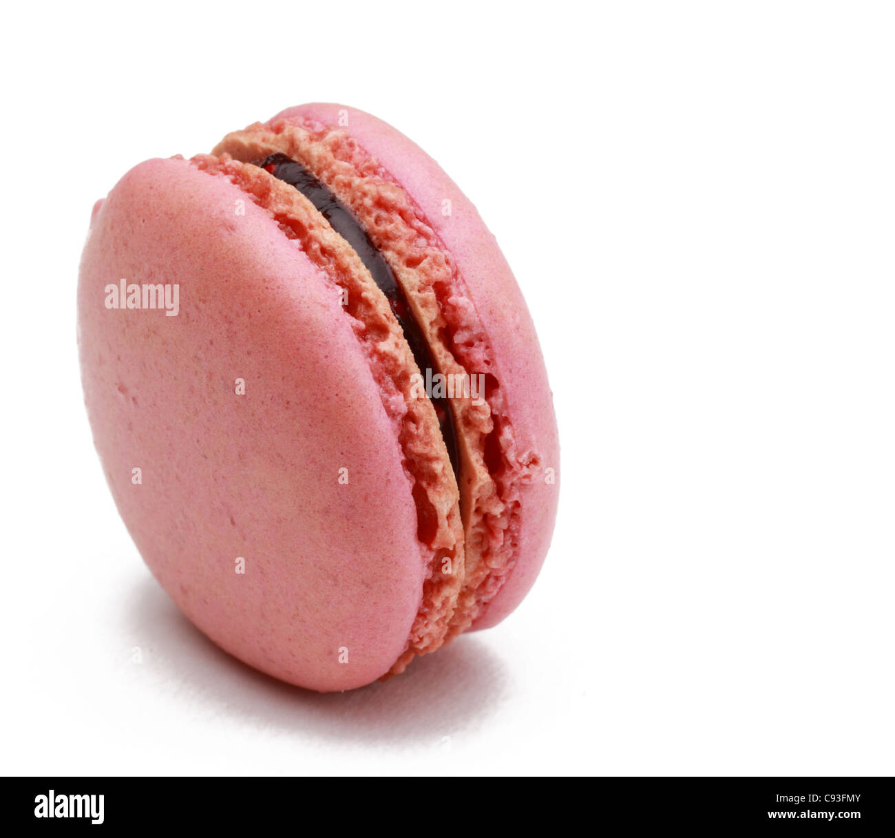 Image of a traditional French pink macaroon against a white background ...