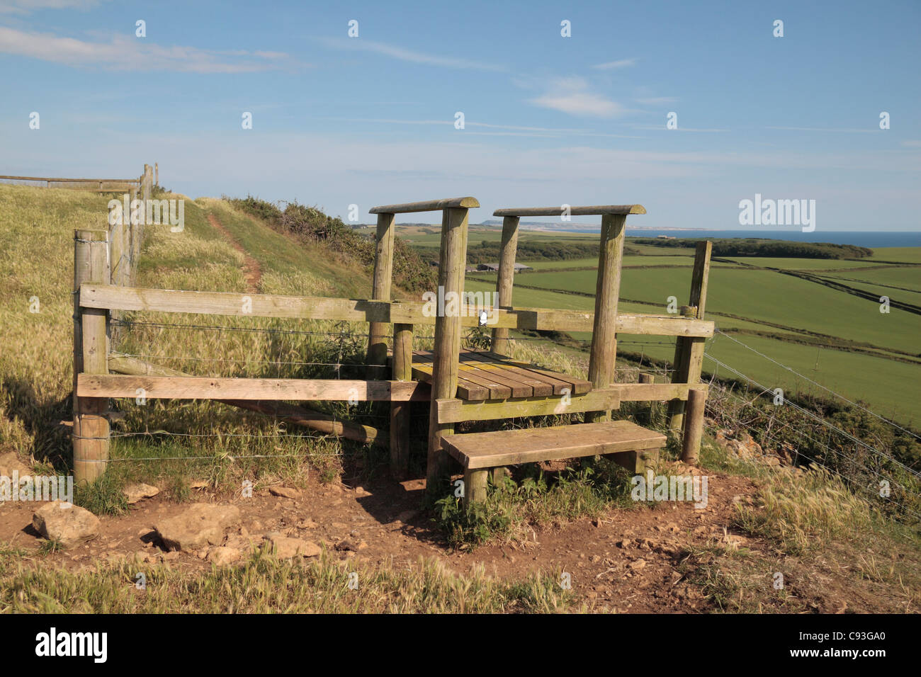 A wooden bridge type public footpath stile on a south coast path (South ...