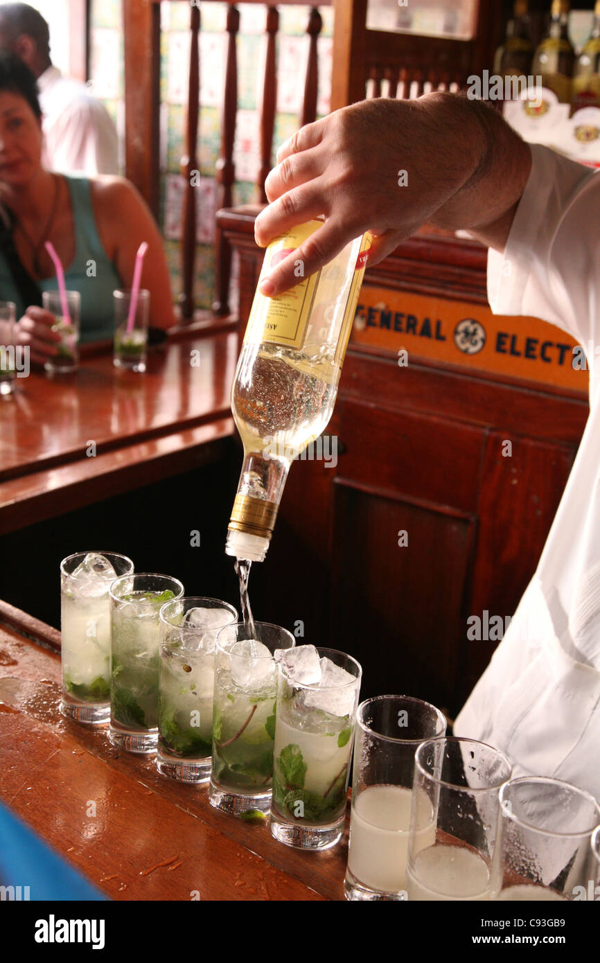 Barman prepares mojito cocktails in the famous bar La Bodeguita del ...