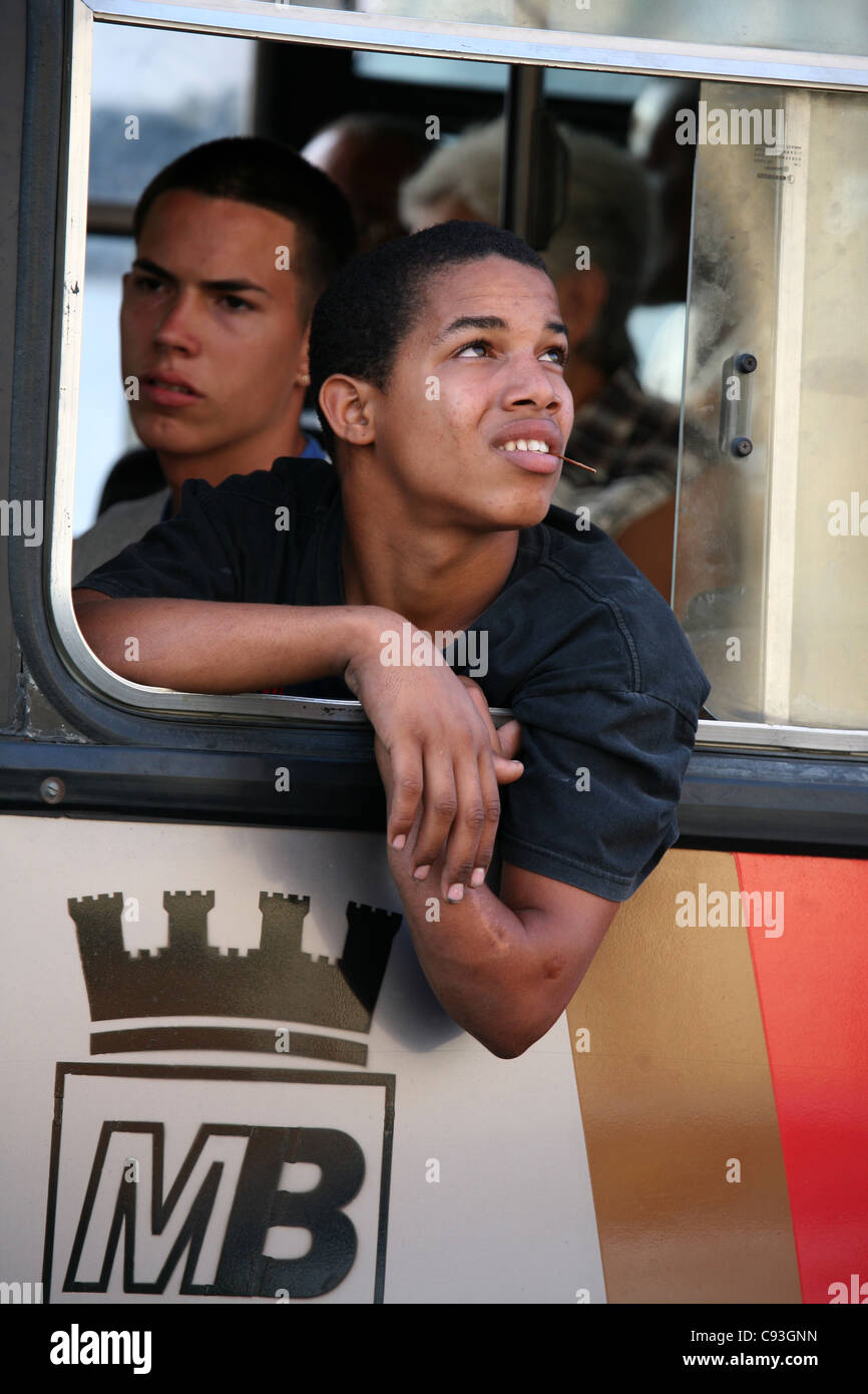 Cuban boy looks out from the public bus in Havana, Cuba Stock Photo - Alamy