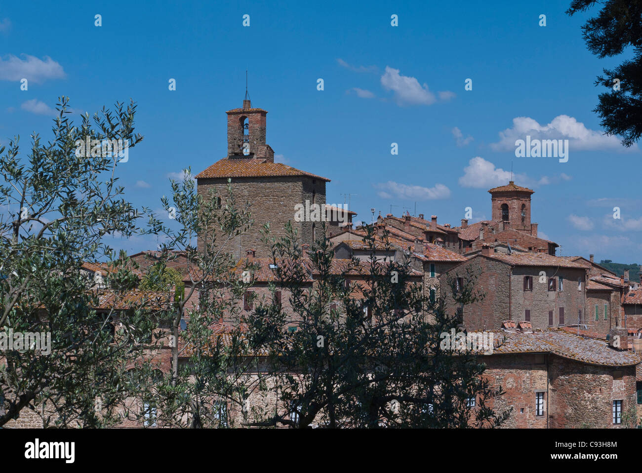 An architectural detail of the red tile roof lines and two towers in ...