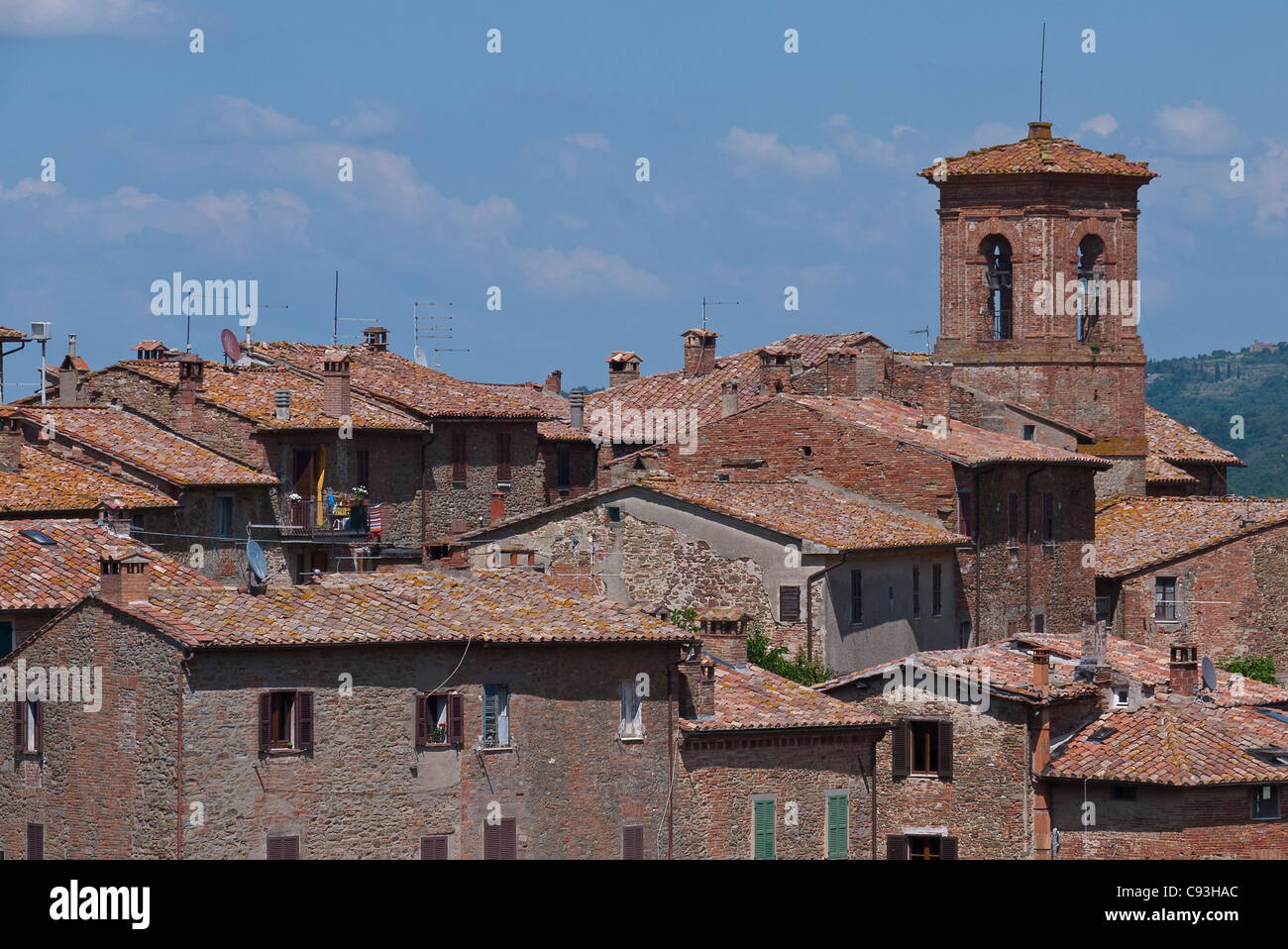 A detail view of the red tile roof lines and a tower of the medieval ...