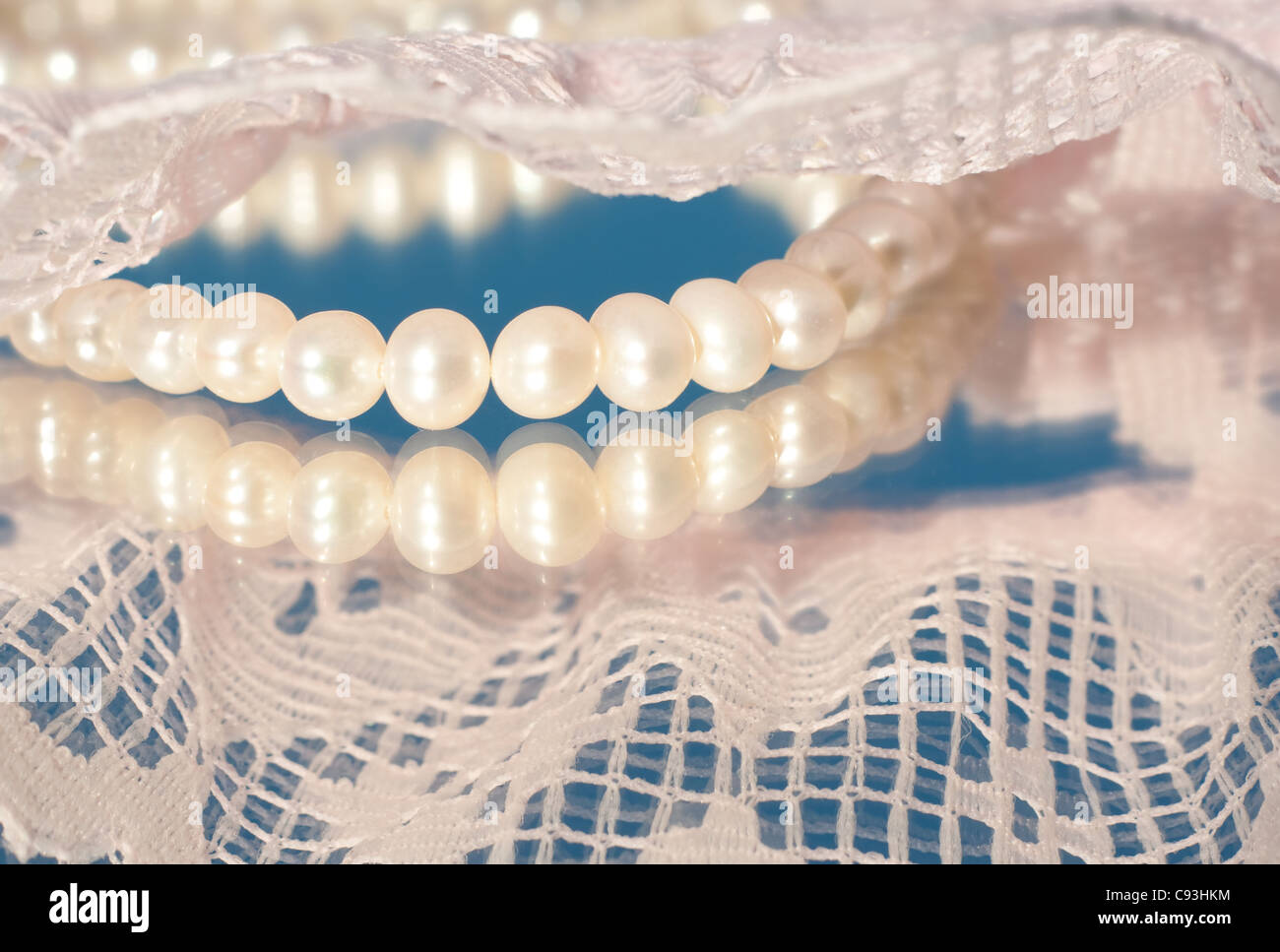 White string of pearls with pink lace Stock Photo - Alamy